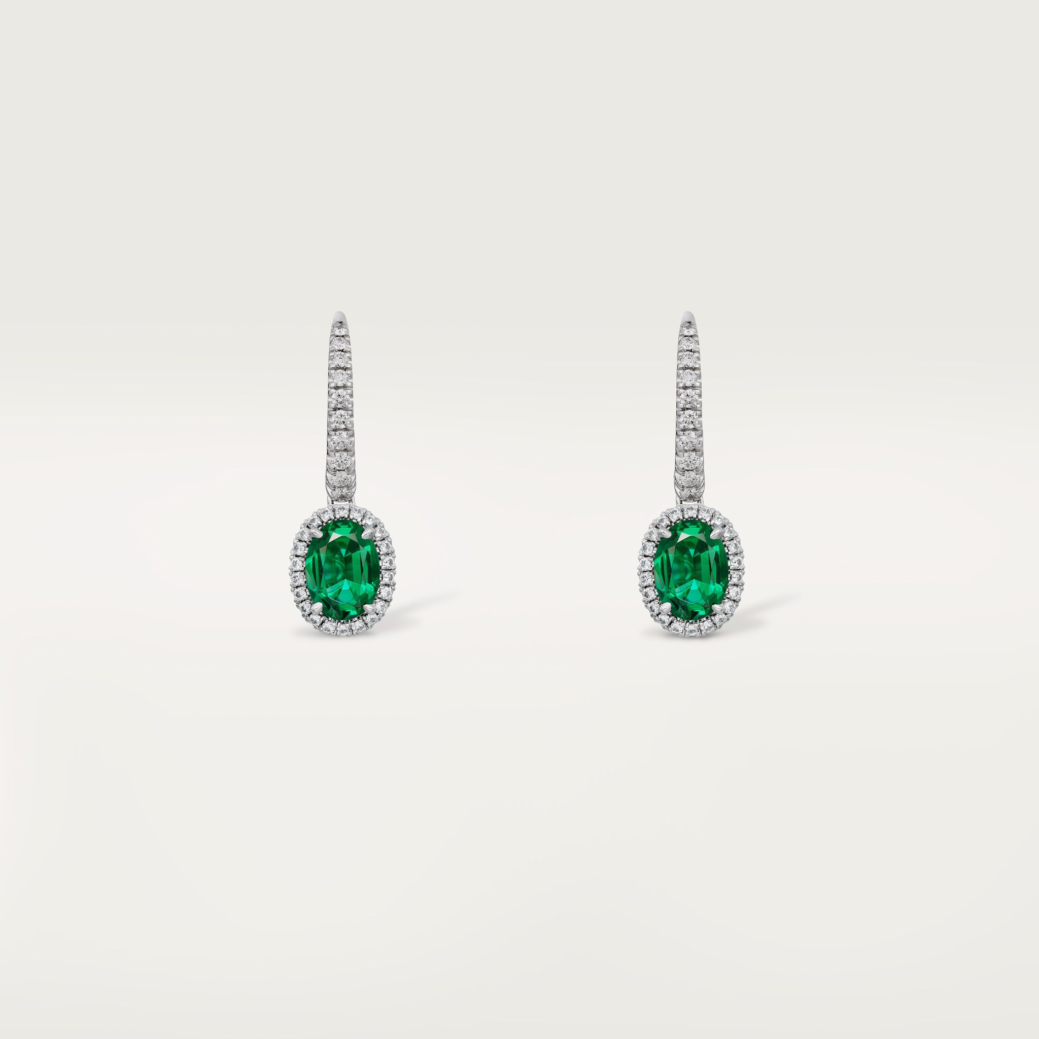 Cartier Destinée sleeper earrings, 2 oval-cut emeralds, paved